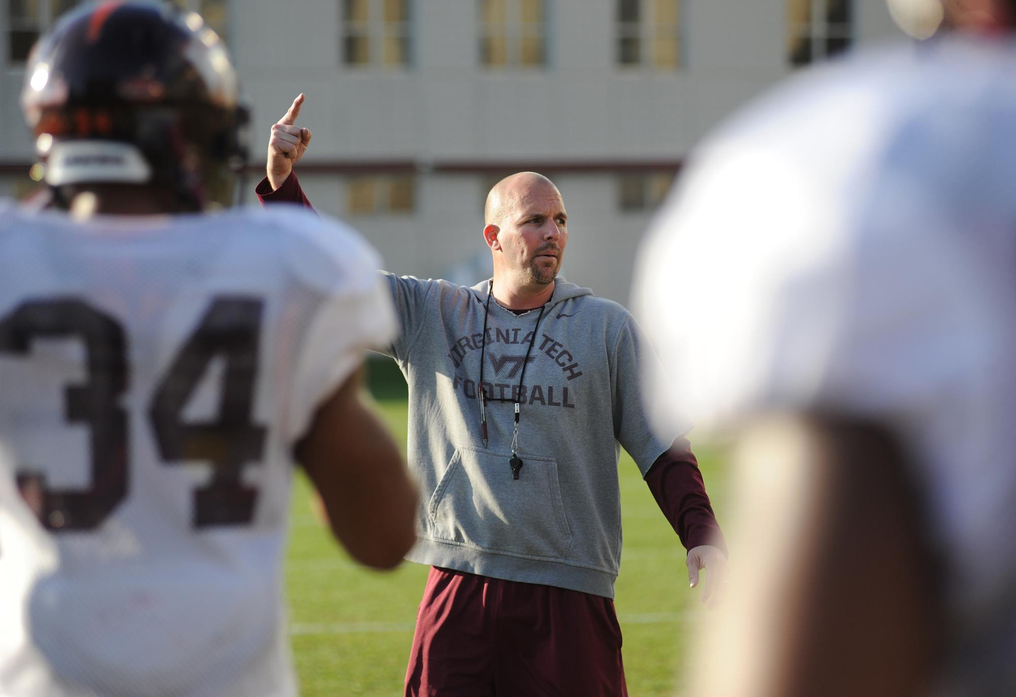 Offensive coordinator Brad Cornelsen chats with Jon Laaser - Virginia ...